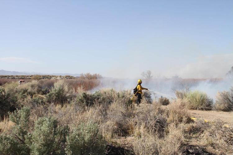 Firefighters continue to battle a wildfire threatening areas of Inyo ...