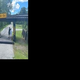 Road closed after railroad bridge beams dislodged in Vassar Township ...