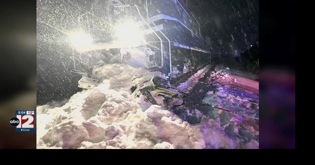 One person taken to hospital after a train crashes into a snowmobile ...
