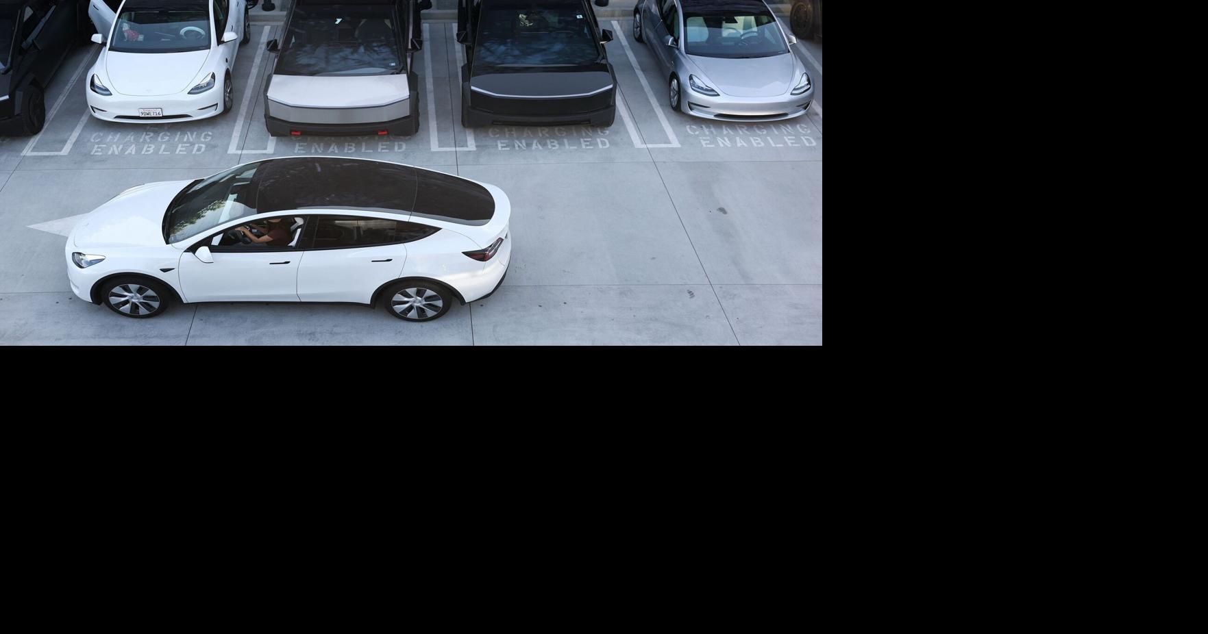 Tesla earnings tumble again on its EV sales slump | Business | abc12.com