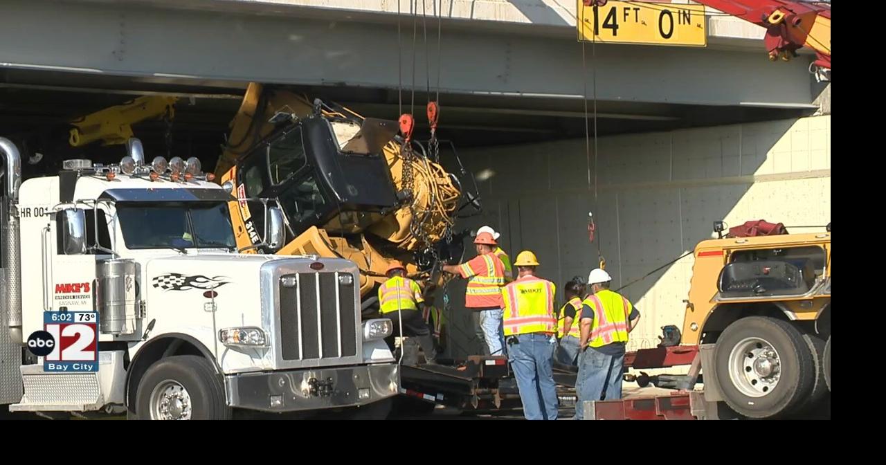 M-13 closed in Saginaw after excavator hits I-675 overpass | Video ...