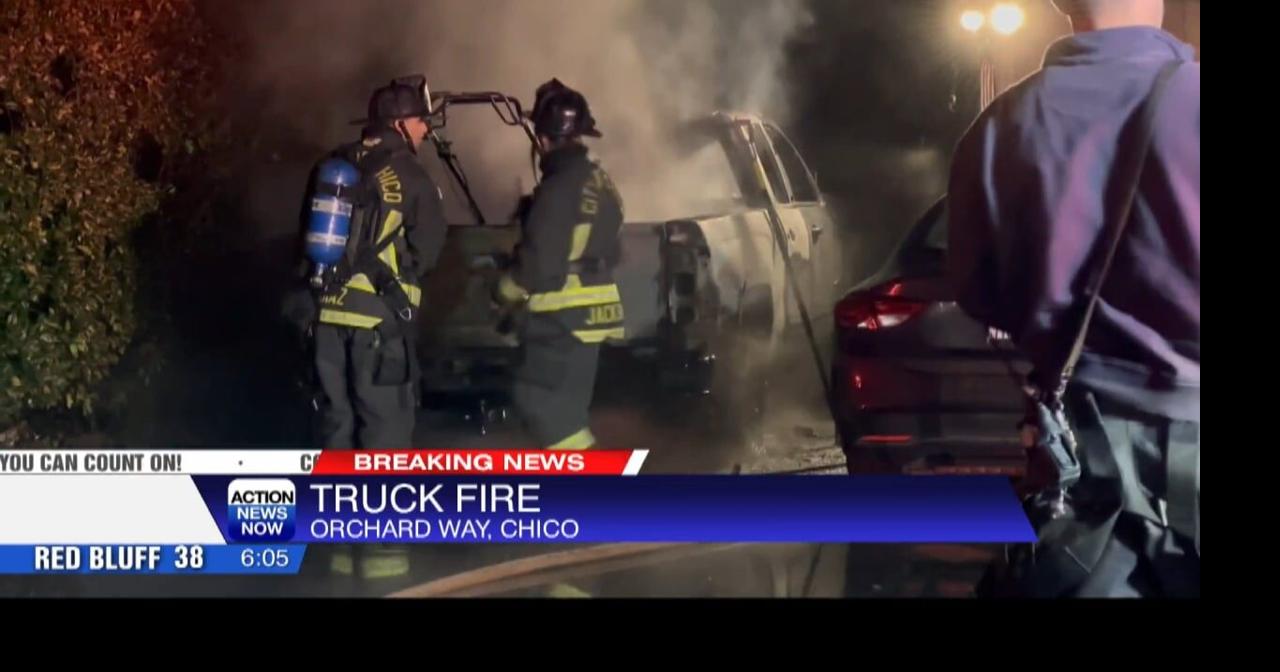 Firefighters put out the flames after a pickup truck caught fire in ...