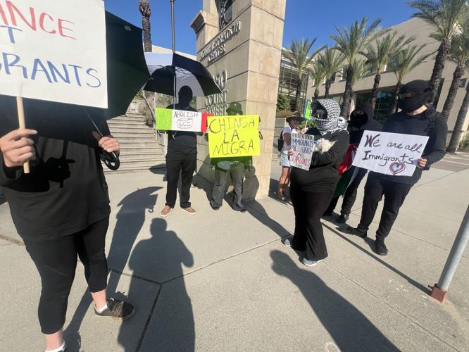 Nearly a dozen people gather in Redding heat to protest ICE ...