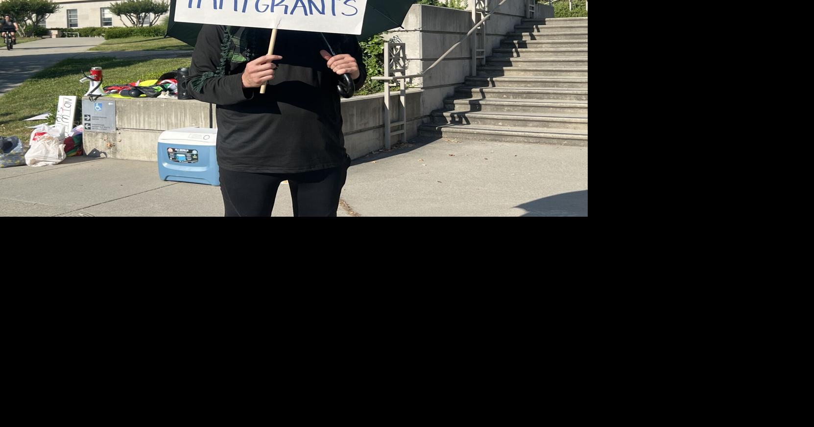 Nearly a dozen people gather in Redding heat to protest ICE ...