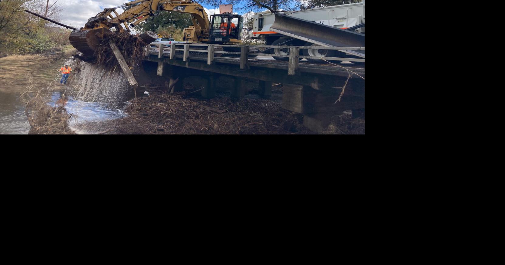 Crews remove debris that formed dam under the Salt Creek Overflow ...