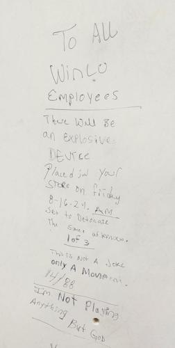 Police are investigating a bomb threat found written on a wall at the ...