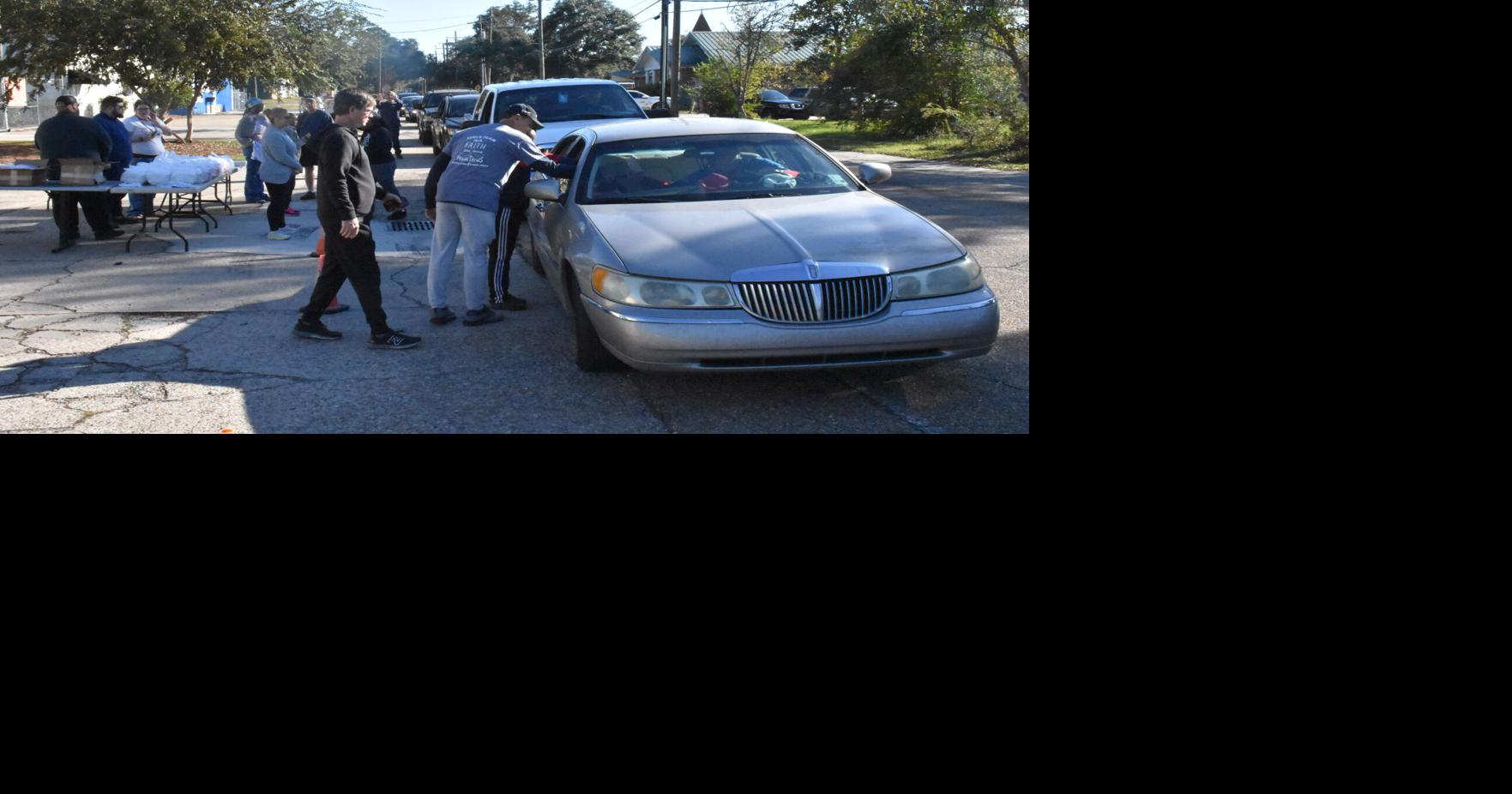 Needy families line up to receive Thanksgiving dinners | Latest Stories ...