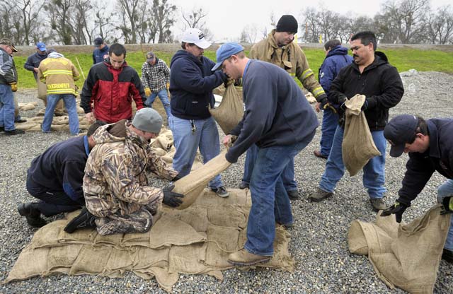 Passing sandbags is in the technique | | appeal-democrat.com