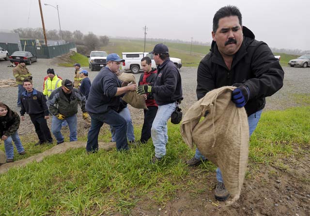 Passing sandbags is in the technique | | appeal-democrat.com