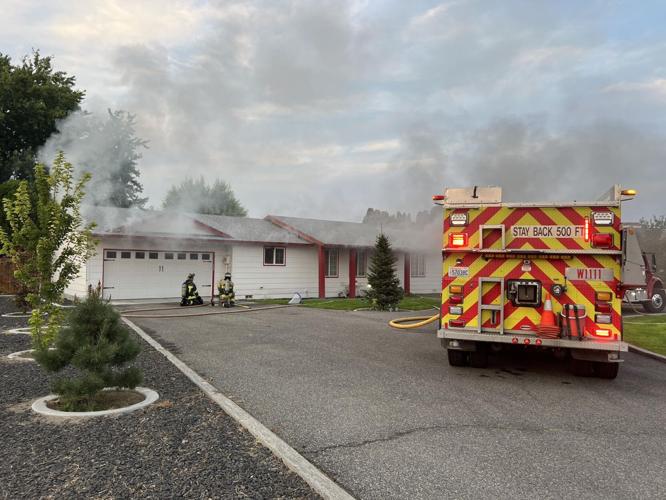 Firefighters help kids return to school after Kennewick house fire ...