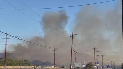 Firefighters working to put out 14-acre brush fire along Yakima ...