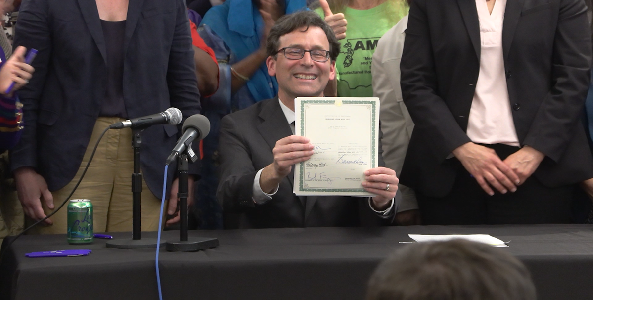 Governor signs rent stabilization bill into law, prompting praise and ...