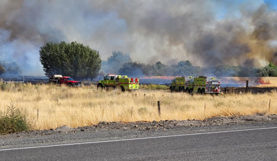 Several crews battle brush fire in Finley, Level 3 evacuations lifted ...