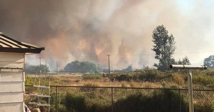 Evacuations lowered as crews gain upper hand on White Swan fire | Local ...