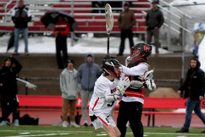 State runner-up hockey players face off in lacrosse season opener ...
