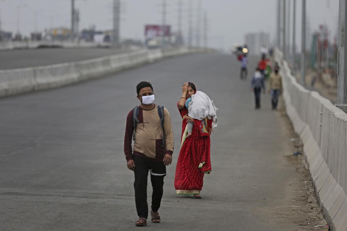 PHOTO GALLERY: Indian migrants walk hundreds of miles to go home ...