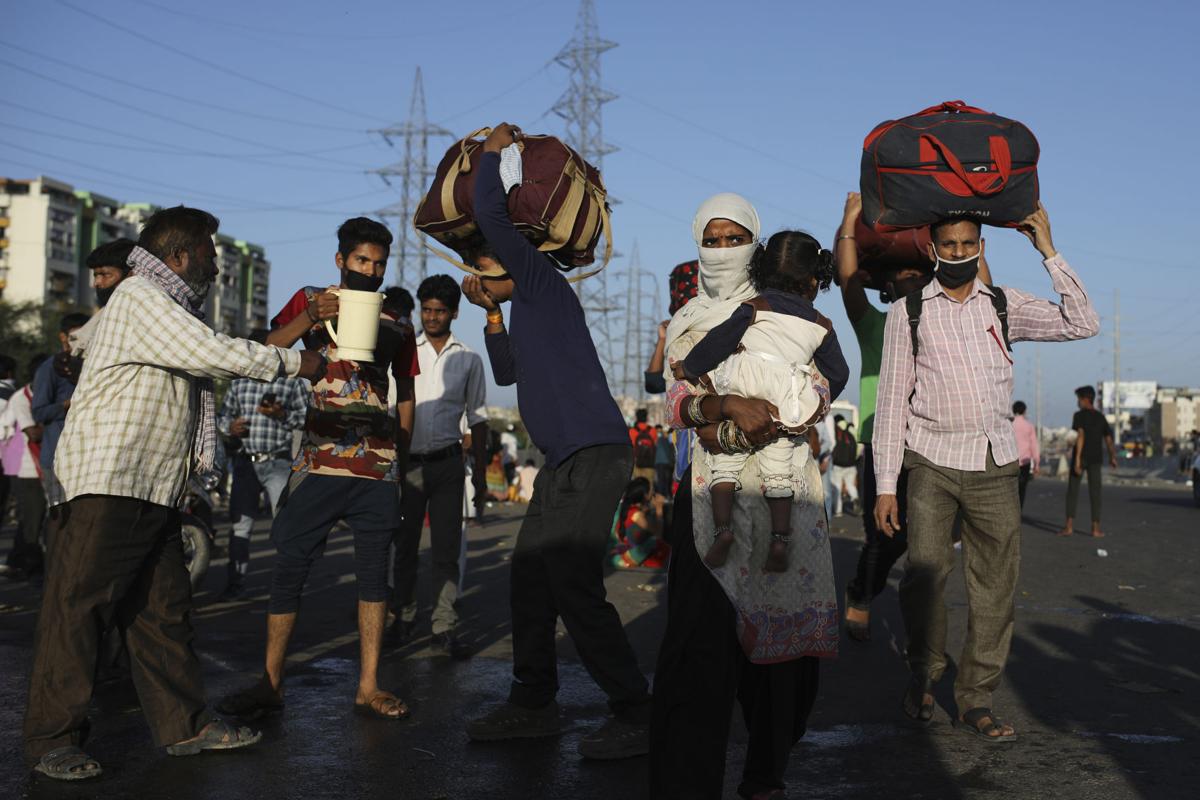 PHOTO GALLERY: Indian migrants walk hundreds of miles to go home ...