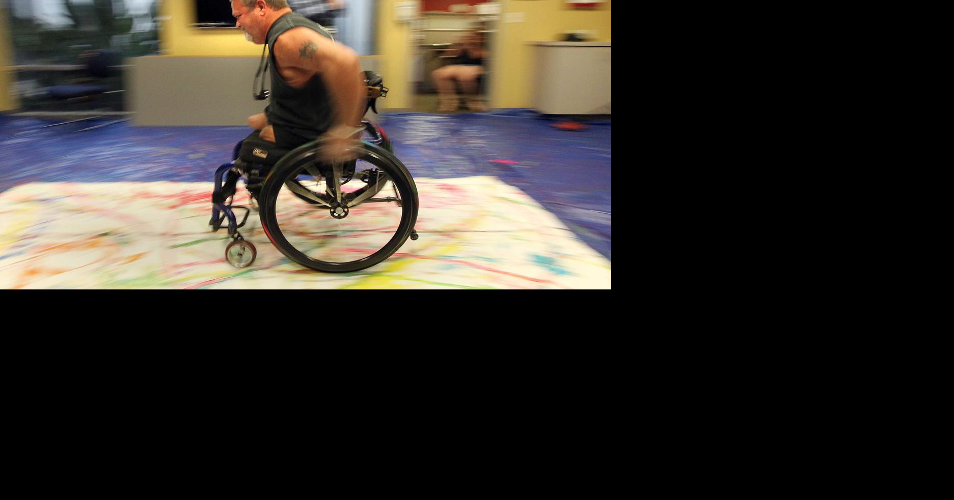 A splash of color: Wheelchairs used to create murals | News ...