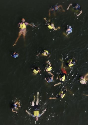 Swimmers jump in for the Baltimore Harbor Splash | People & Society ...