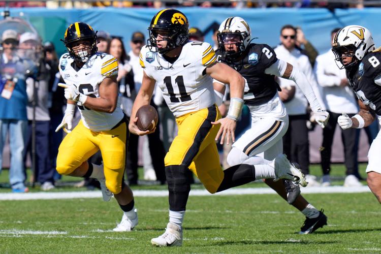 Vanderbilt punter's illegal kick sets up Iowa for an easy touchdown in ...