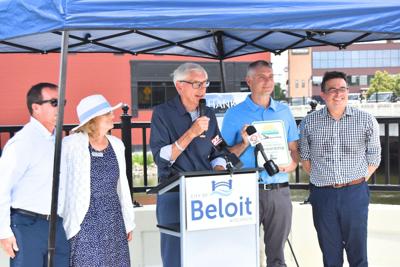 Gov. Evers helps cut ribbon on riverwalk project, Hendricks commits to ...