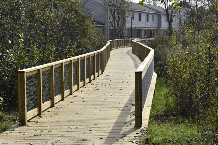 New path connects Orchard Village, Willow Brook residential communities ...