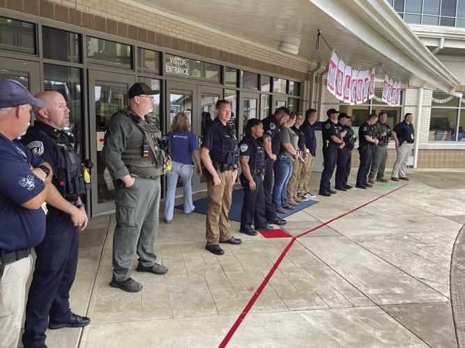 Showing support: Several officers greet Bryant student on first day of ...