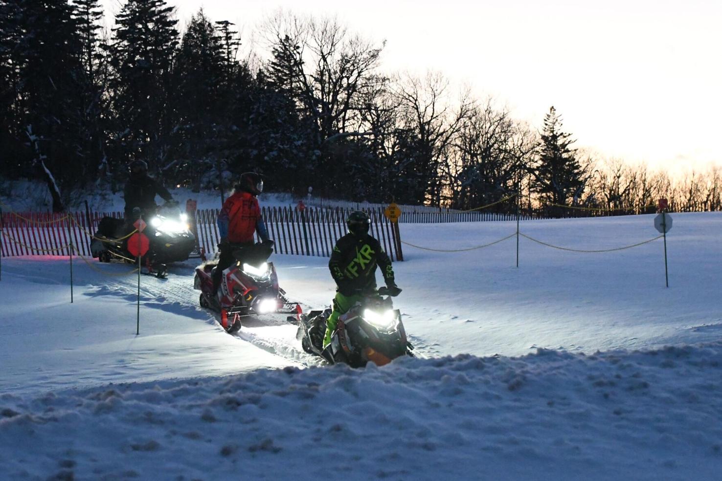 Snowmobilers stop to cross a higway | | The Berkshire Eagle