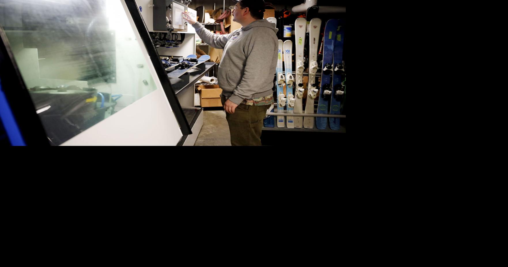 Levi Brown operating ski tuning machine | | The Berkshire Eagle