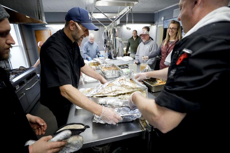 Photos: Thanksgiving meal delivery and community dinner at The ...