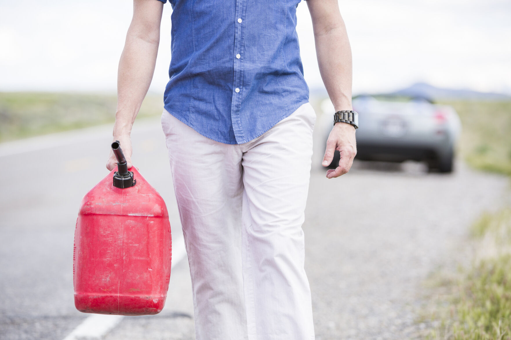 Caucasian man carrying gas on street | | The Berkshire Eagle
