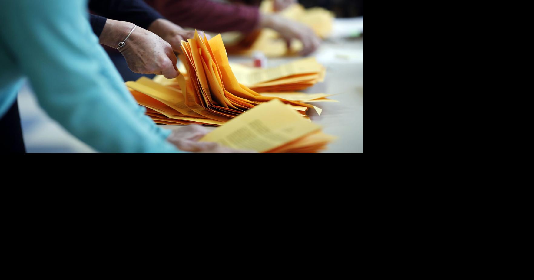 people sorting yellow paper ballots | | berkshireeagle.com
