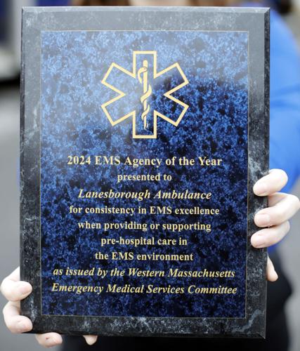 Jennifer Weber holding up EMS award | | berkshireeagle.com