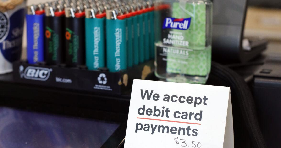 sign at register accepting debit transactions | | berkshireeagle.com