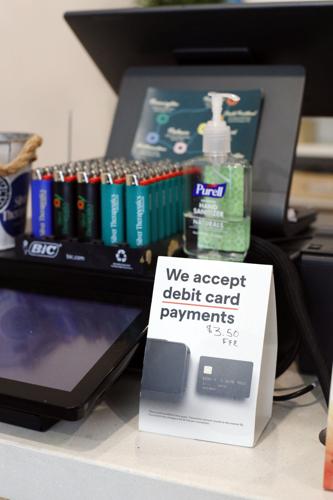 sign at register accepting debit transactions | | berkshireeagle.com