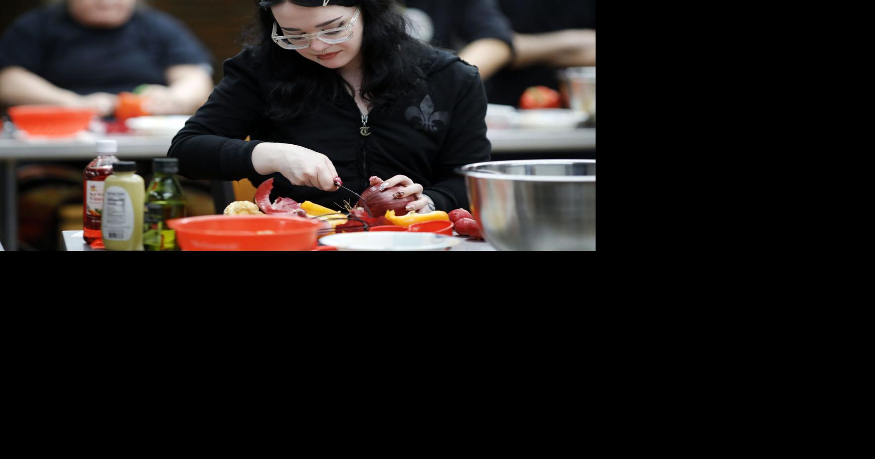 Morgan Mickle chopping onion | | berkshireeagle.com