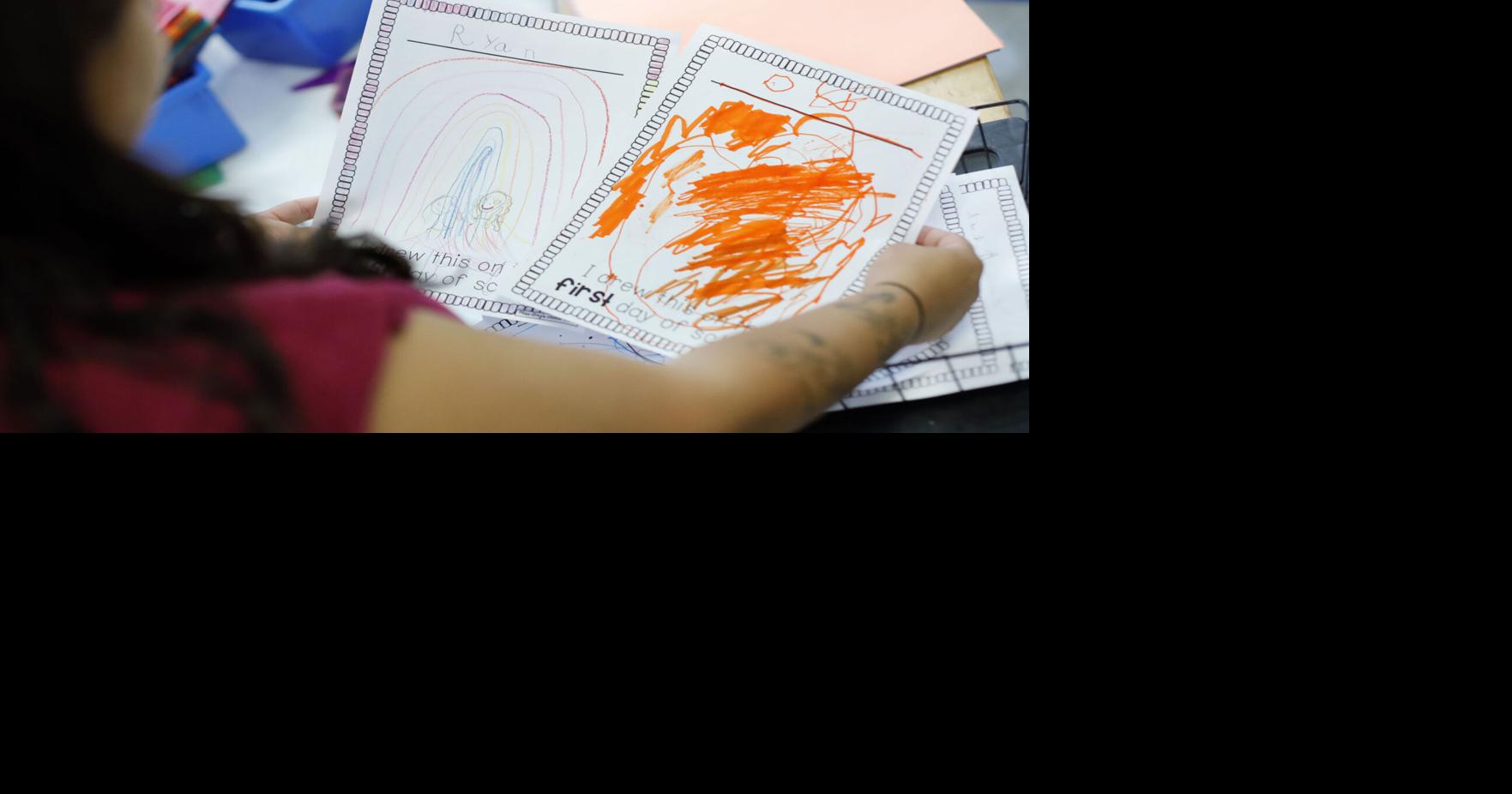 woman holding drawings side by side | | berkshireeagle.com