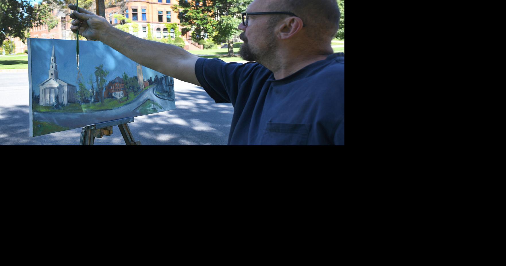 Alvin Ouellet holds his paint brush up for measure | | The Berkshire Eagle