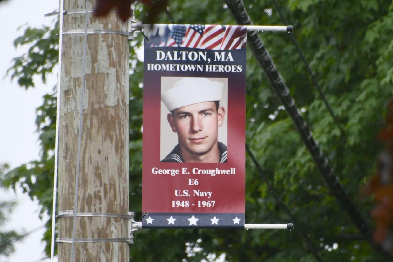 A banner hangs on a utility pole | | The Berkshire Eagle