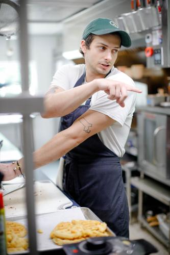 Kevin Kelly in kitchen pointing | | berkshireeagle.com