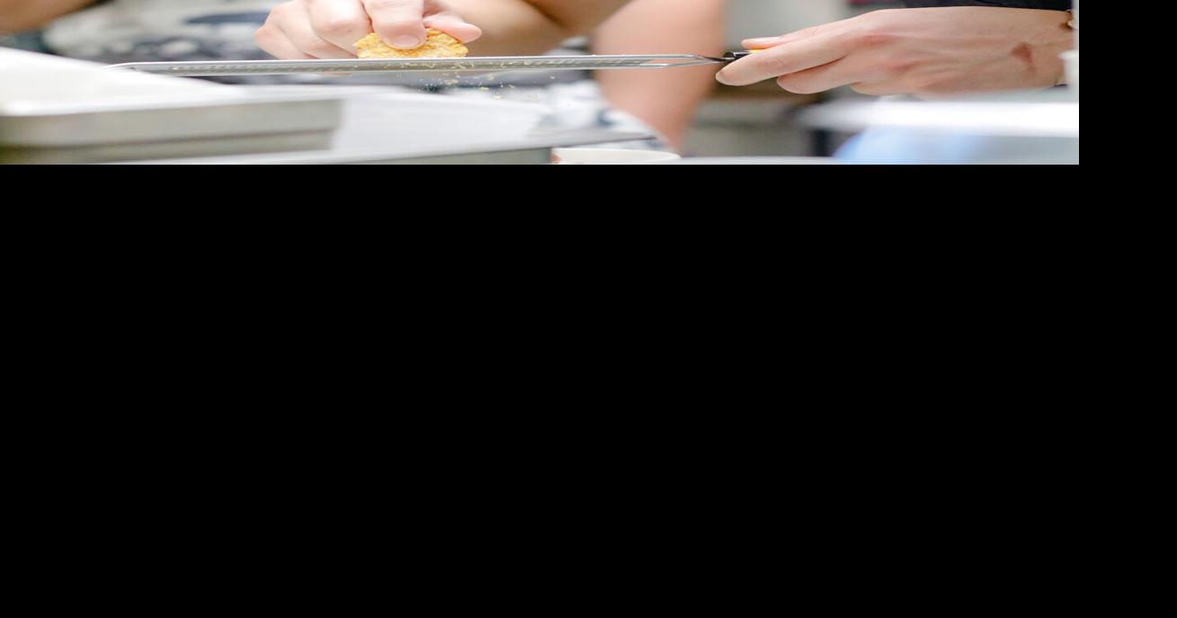 chef grating egg yolk over dish | | berkshireeagle.com