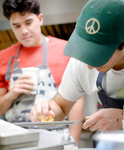 chef grating egg yolk over dish | | berkshireeagle.com