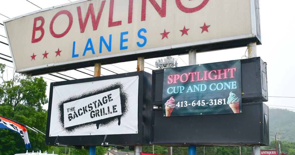 A sign with multiple businesses | | The Berkshire Eagle