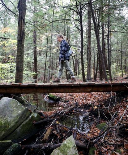 Molly Urbain walking over forest bridge | | berkshireeagle.com