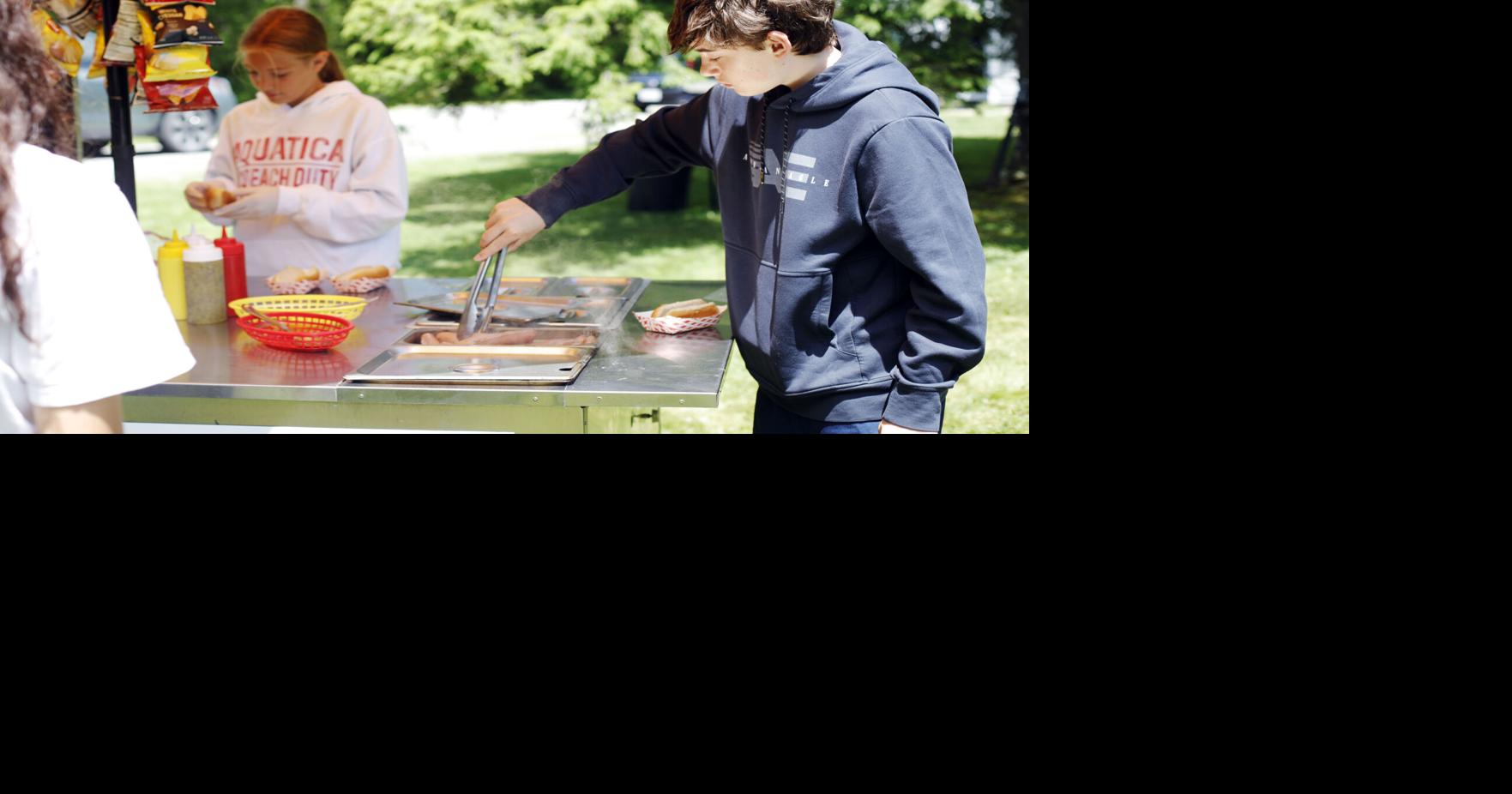 Olivia and Ethan Lemon serving hot dogs at cart | | berkshireeagle.com