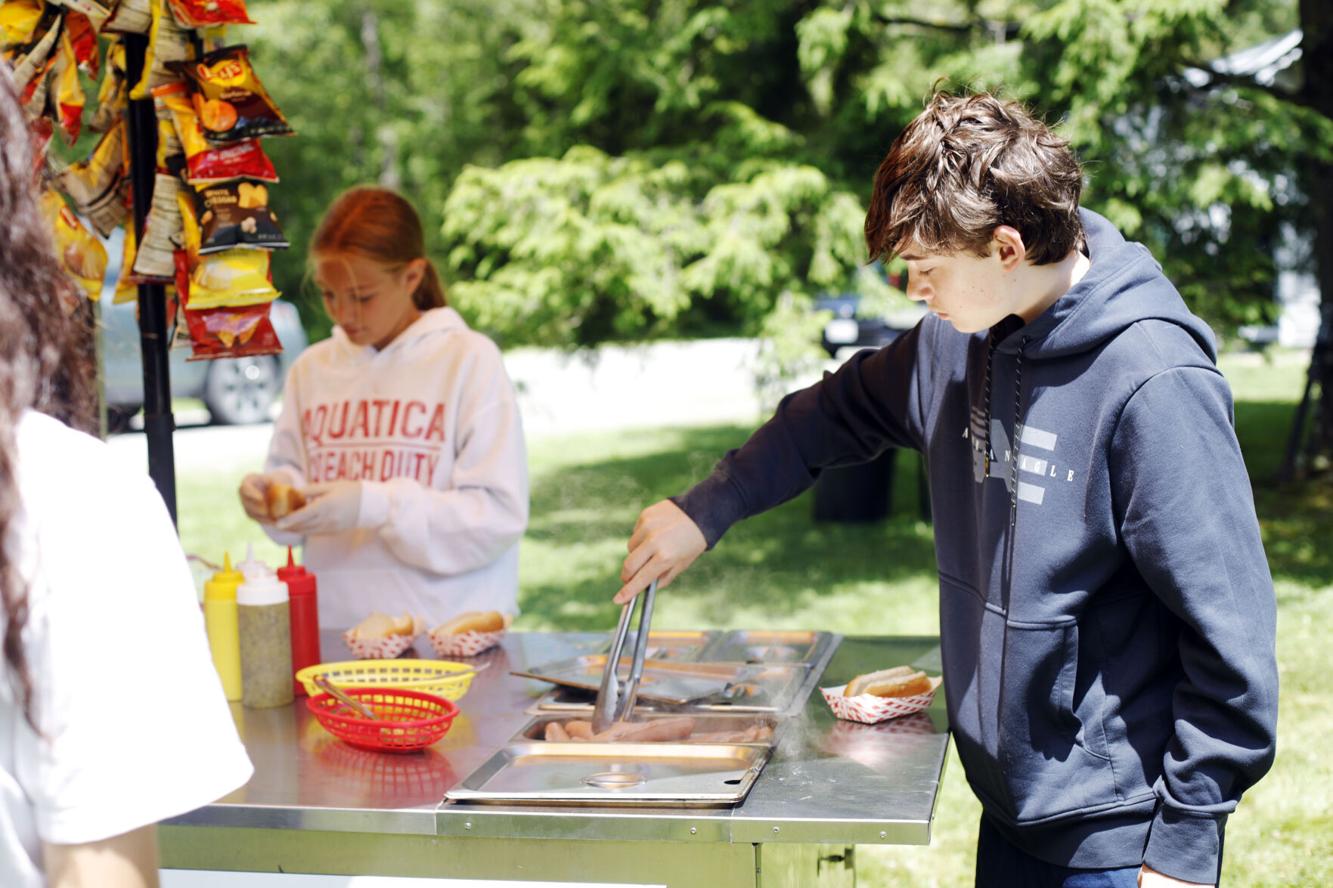 Olivia and Ethan Lemon serving hot dogs at cart | | berkshireeagle.com