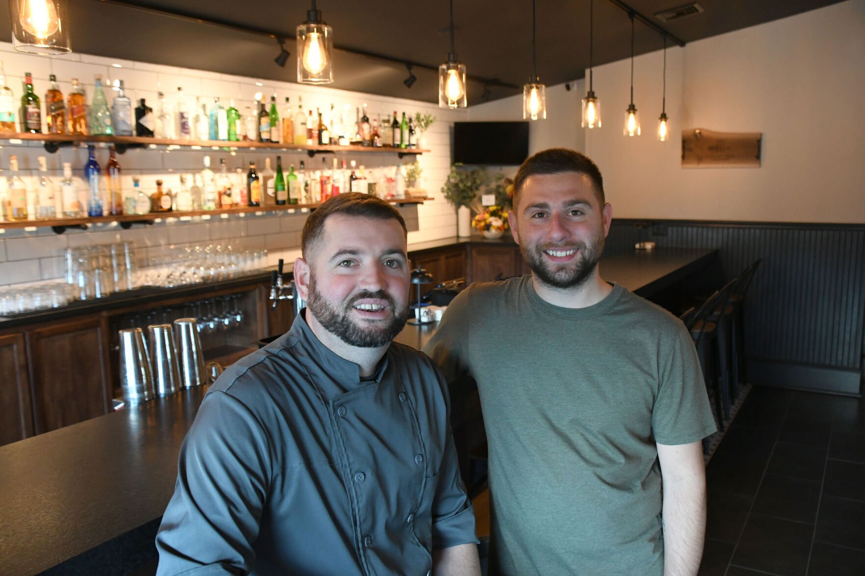 Two men pose at a bar | | berkshireeagle.com