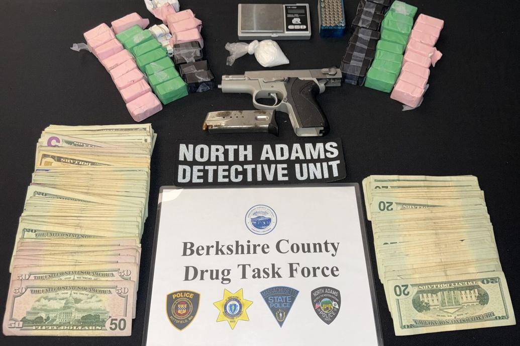 Police seized drugs, cash and a loaded weapon during a raid at a North ...