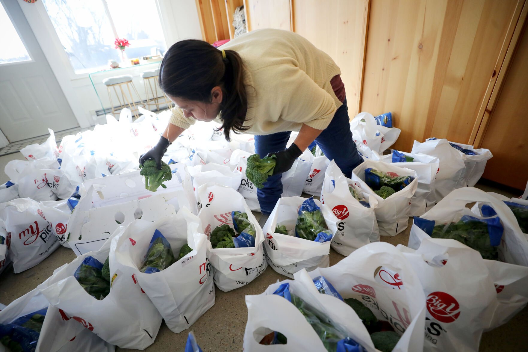 Lourdes Corrales packing food bags | | berkshireeagle.com