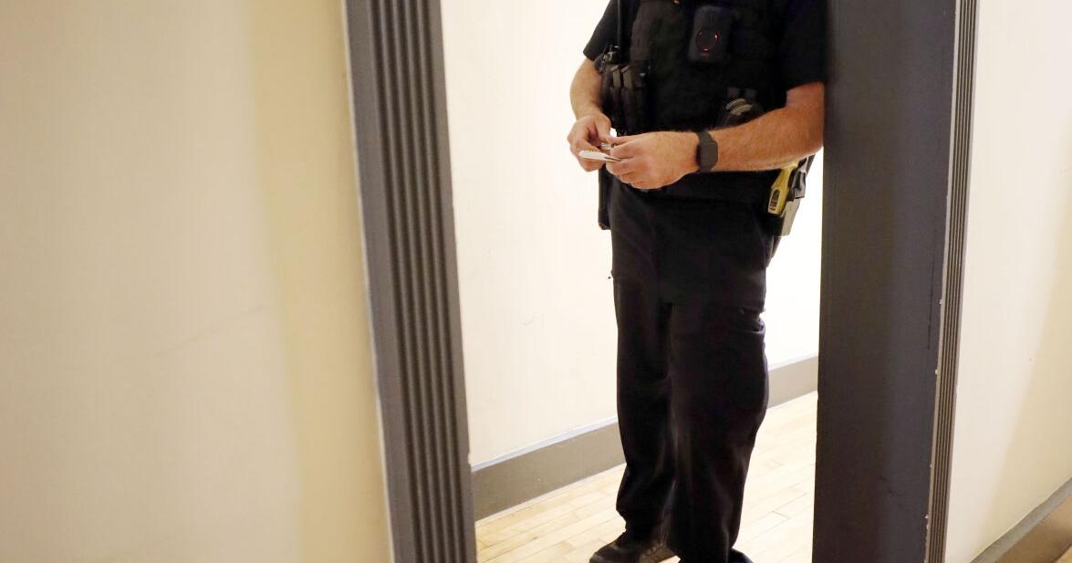 police officer leaning against wall in hallway | | berkshireeagle.com